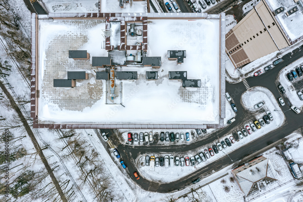 snow-covered roof of high-rise apartment building with ventilation ...
