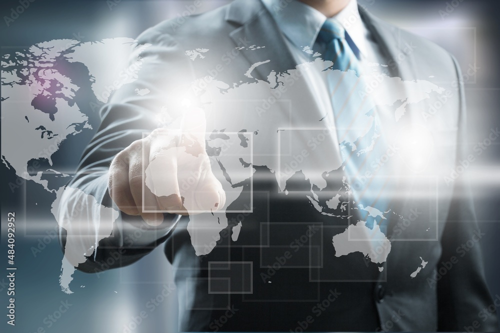 Man pointing finger at the sign, depicts a world map, represents the ...