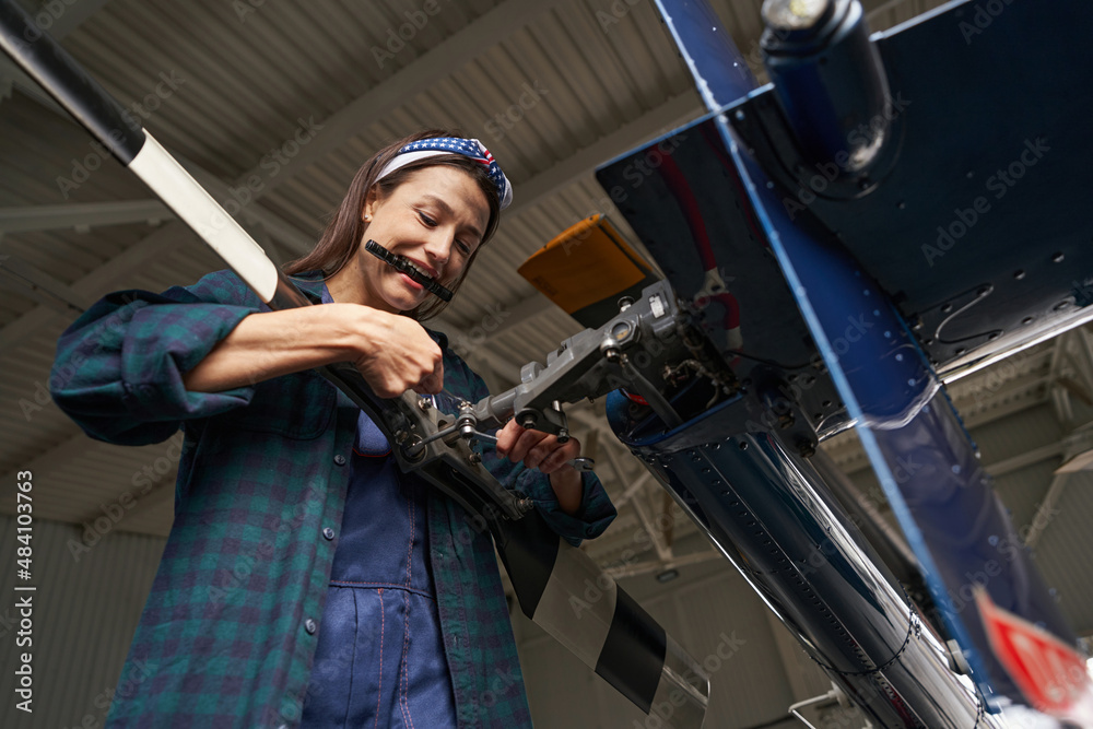 Female engineer modernization and renovating motor of airplane in ...