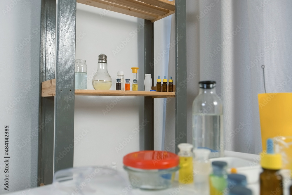 Home school chemistry class laboratory with reagents, jars, flasks and ...