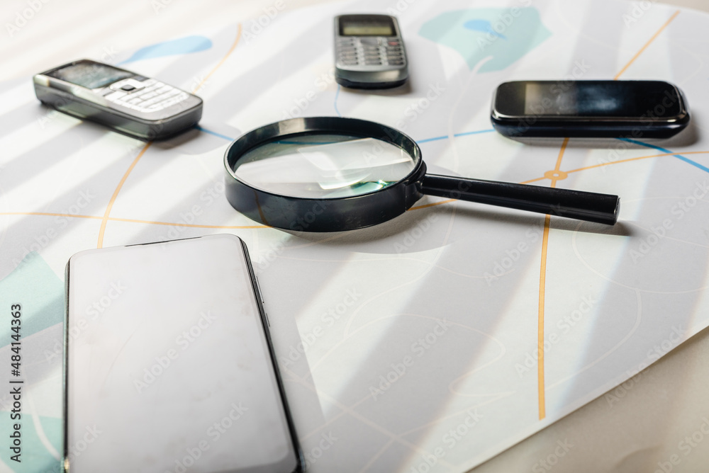 Workplace of private detective with professional equipment for ...