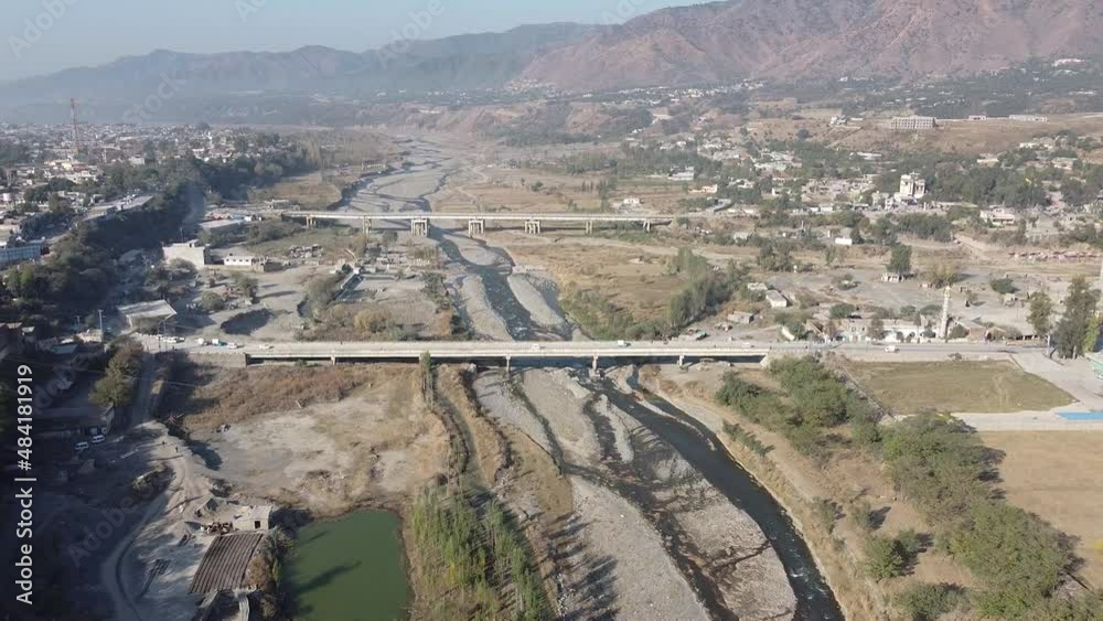 Transport crosses the main bridge of Havelian in Pakistan connecting ...