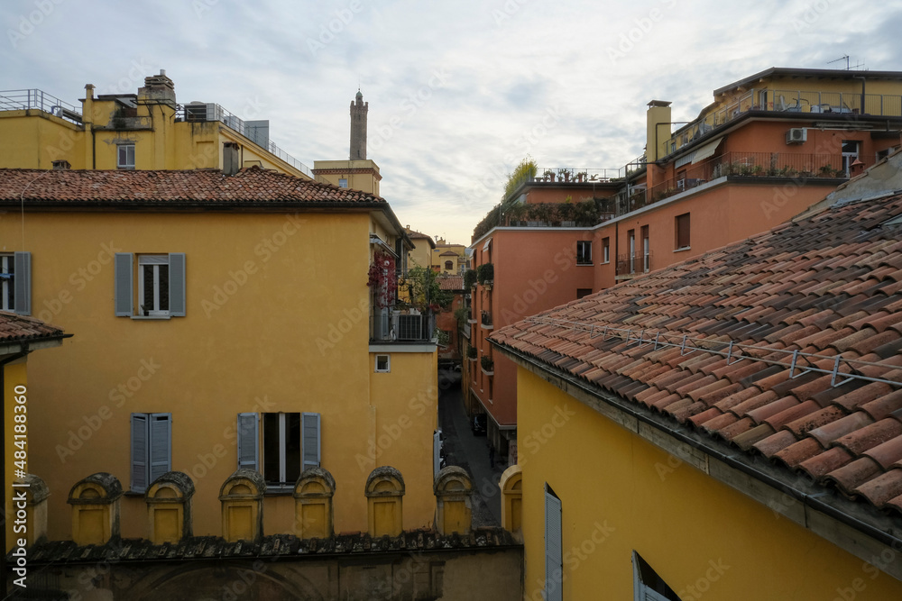 view of the red-tiled roofs of yellow houses and orange buildings in ...