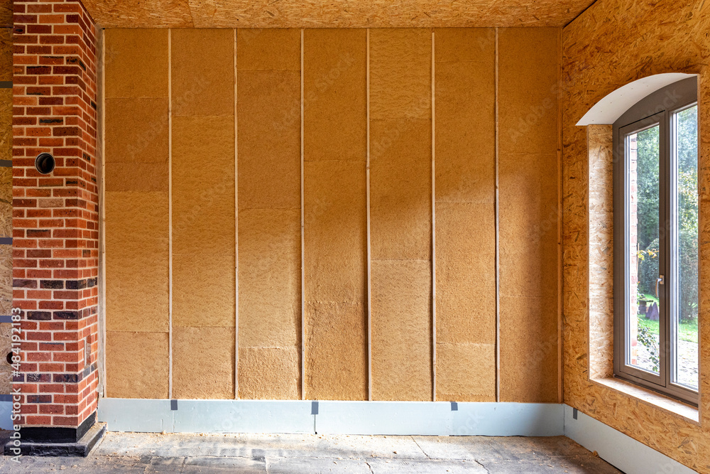Installing thermal insulation inside a building, wood fiber boards ...