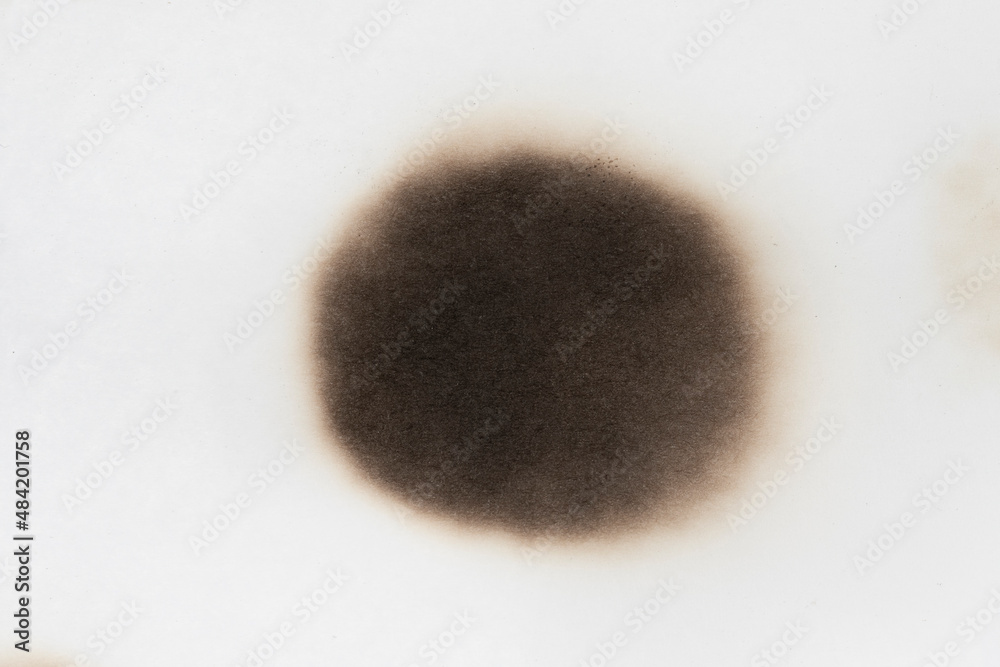 Paper burn black stain isolated over the white background. Round paper ...