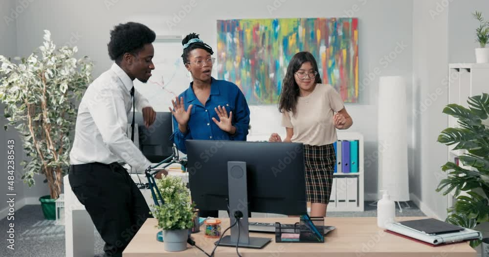 Dance at work, office, break from duties, company party, two girls and ...