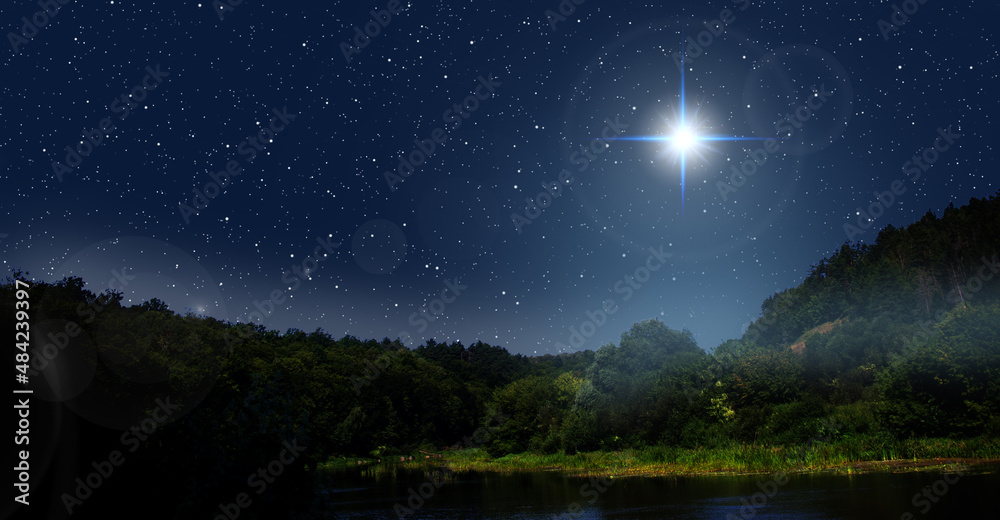 Bright star indicates the Nativity of Jesus Christ in the starry sky ...