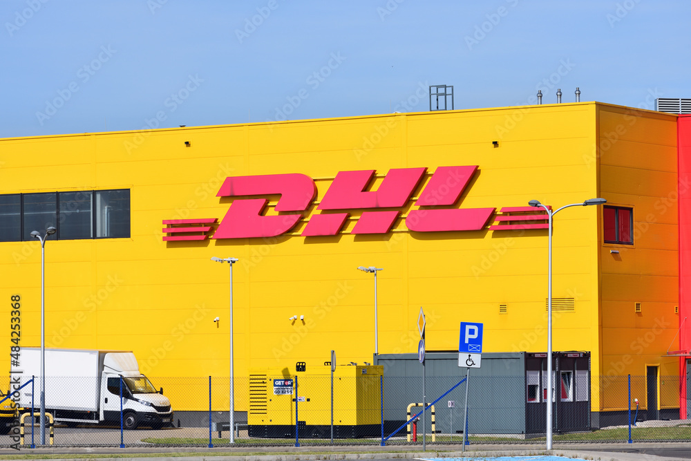 DHL signage, logo on the facade of DHL Express Service Point at Cargo ...