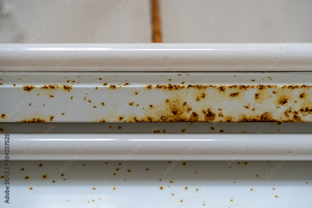 Close up of a rust film on a metal part of a hanging lamp. Flash rust ...