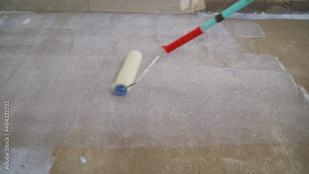 The process of priming a plastered surface. Concrete floor primer to ...