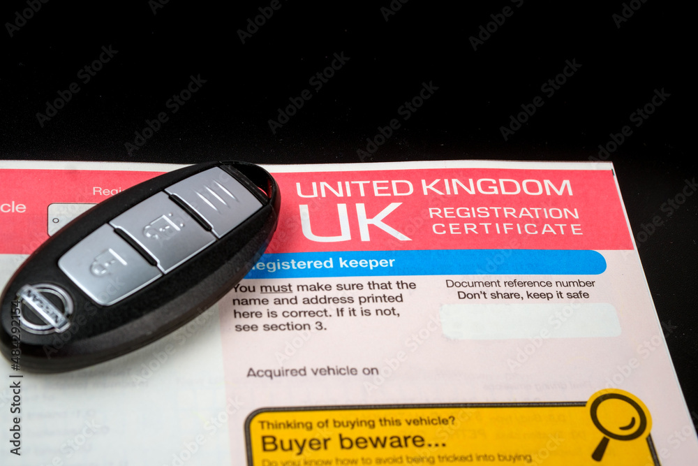 Genuine UK registration certificate for a purchased car seen on photo ...