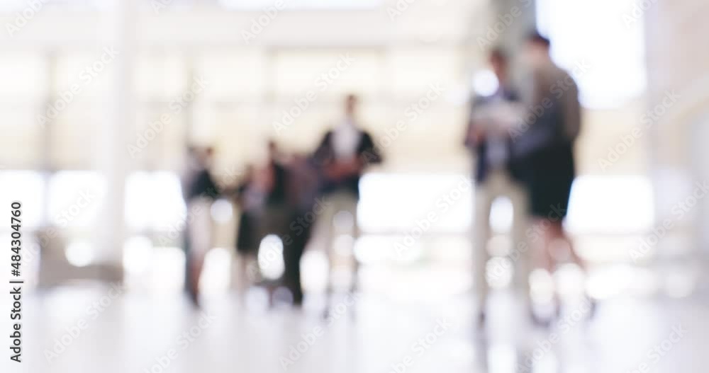 Coming together one business at a time. Blurred businesspeople standing ...