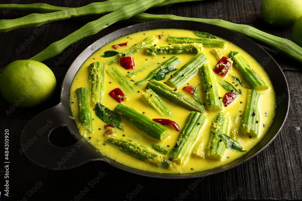 Moringa oleifera, muringa raw green mango curry. Kerala vegetarian ...