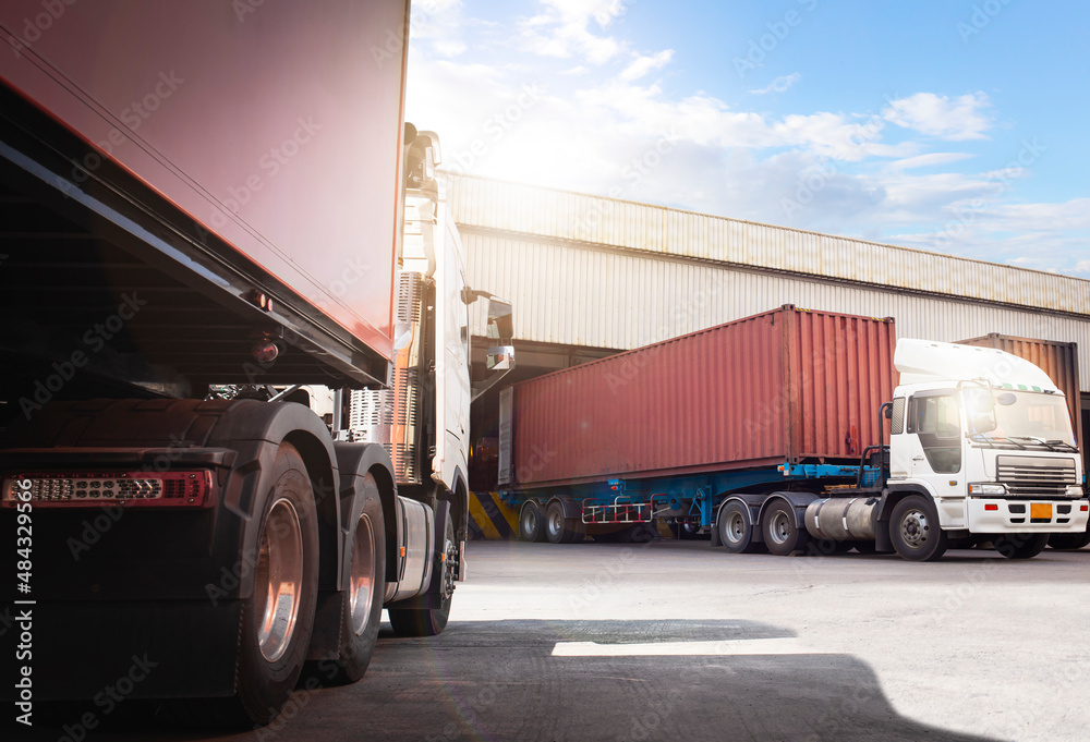Foto de Semi Trailer Trucks Parked Loading at Dock Warehouse. Shipping ...