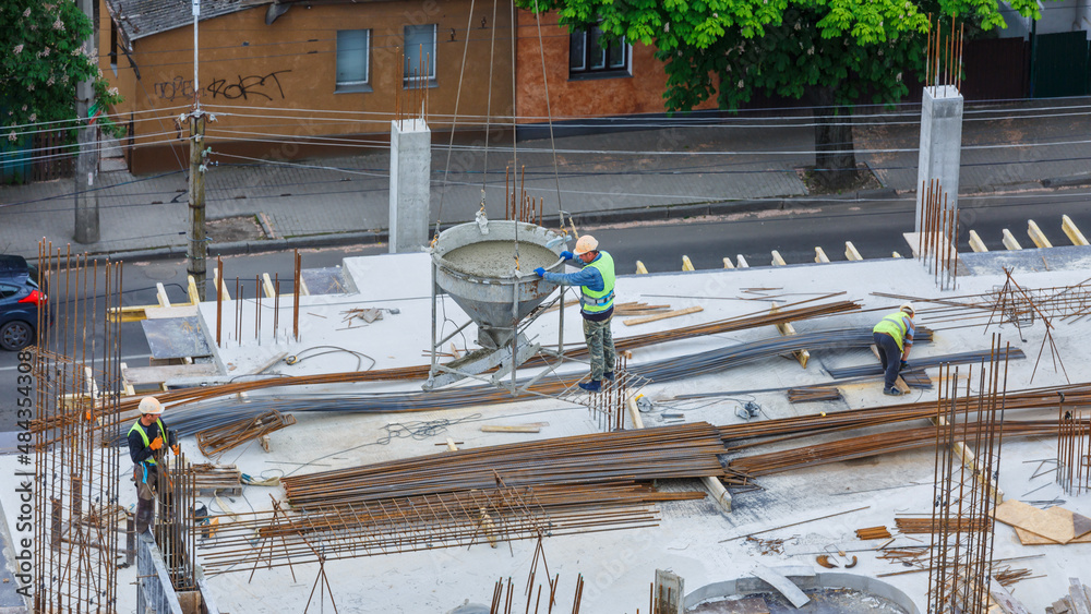 Building construction site work against blue sky.Hydraulic luffing jib ...