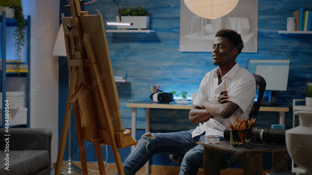 Adult of african american ethnicity designing vase on canvas for ...