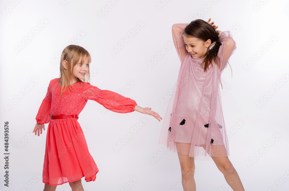 Playful kids, funtime concept. Portrait of cute two girls 6-8 years old ...