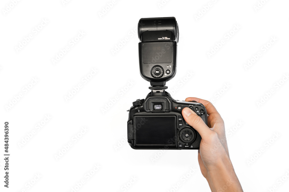 man holding reflex camera with on-camera flash on white background top ...