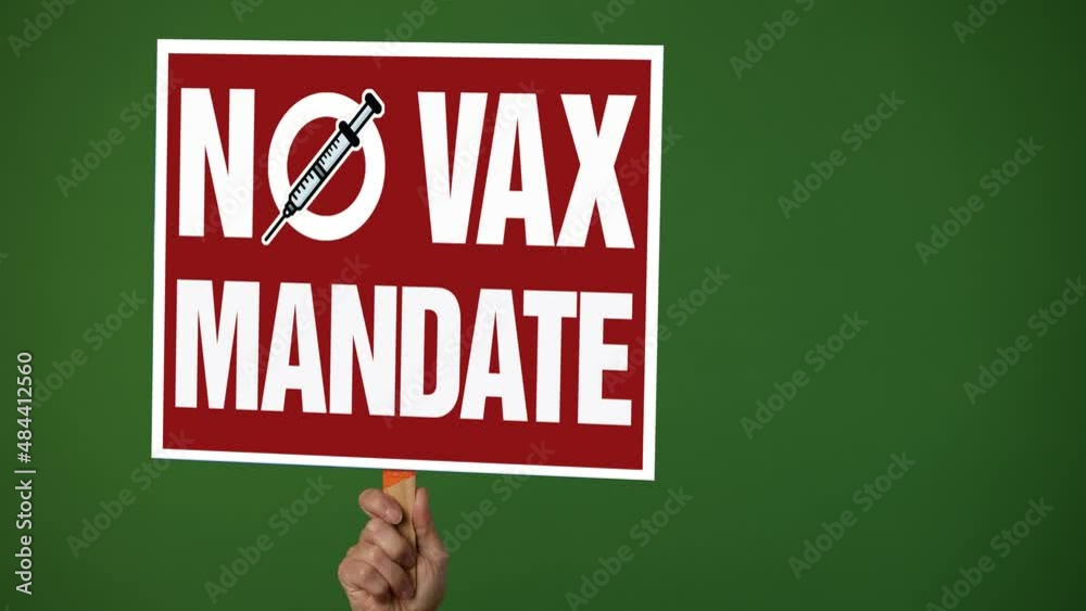 Hand holding sign banner with text No VAX Mandate in protest of covid ...