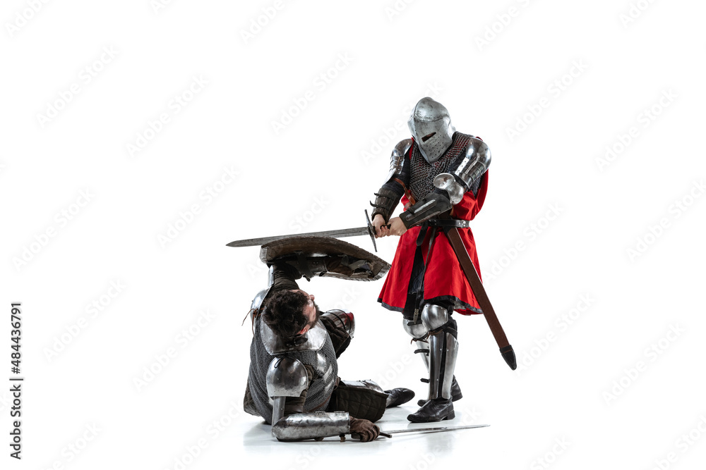 Full-length portrait of two medieval warriors, knights fighting ...