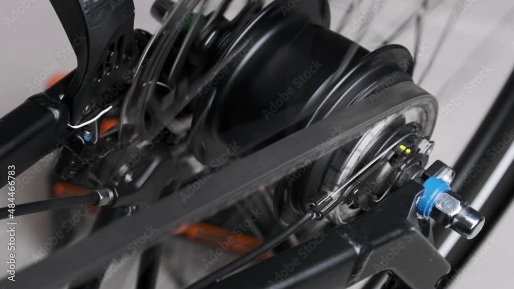 The planetary hub on a belt drive bicycle rotating. Rotation of the ...