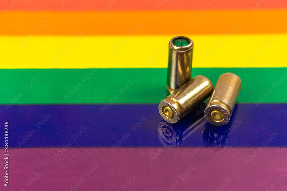 LGBT pride rights flag with gun bullets. Criminal, danger, gay and ...