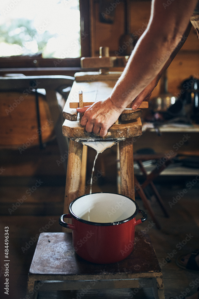 Cheese making. Person making cottage cheese using cheese press and ...