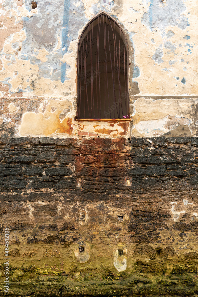Architecture. Castle. Window with iron bars in an old stone wall Stock ...