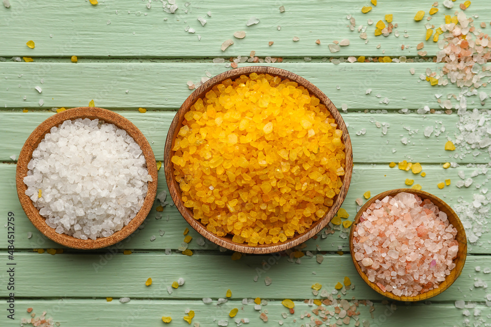 Bowls of different sea salt on color wooden background Stock Photo ...