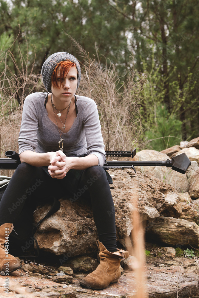 Beautiful and intense redhead sniper woman with .50 caliber rifle ...