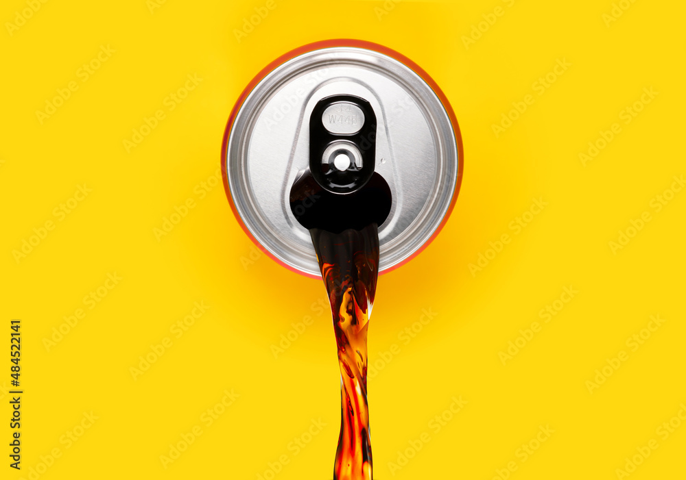Cola soda can pouring out. Spilling energy or soft drink out of can on ...
