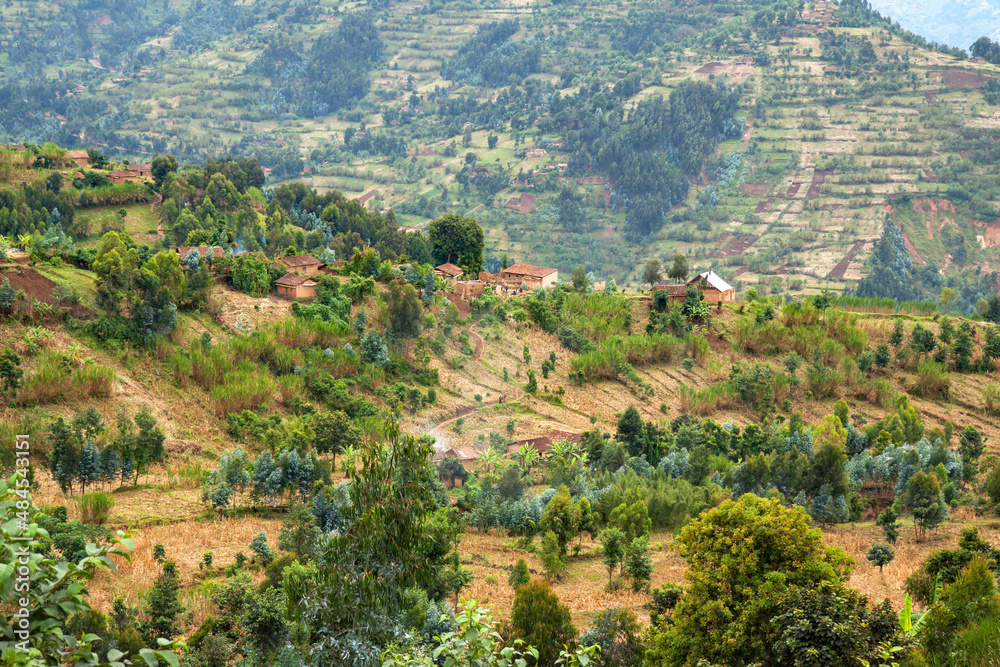 Rural landscape with houses and cultivated land on steep hills in ...
