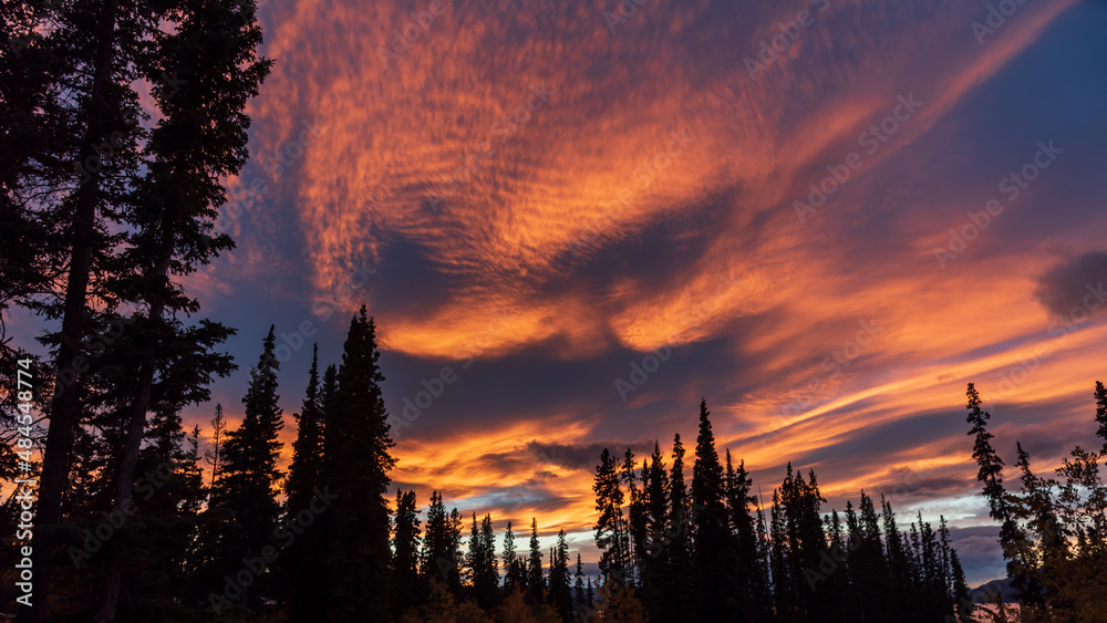 Incredible patterns in sunset sky with orange, pink and purple colors ...