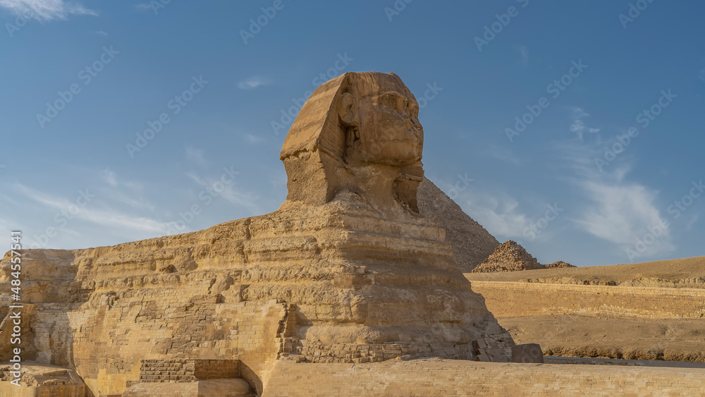 Giant statue of the Great Sphinx against the blue sky. Profile view ...