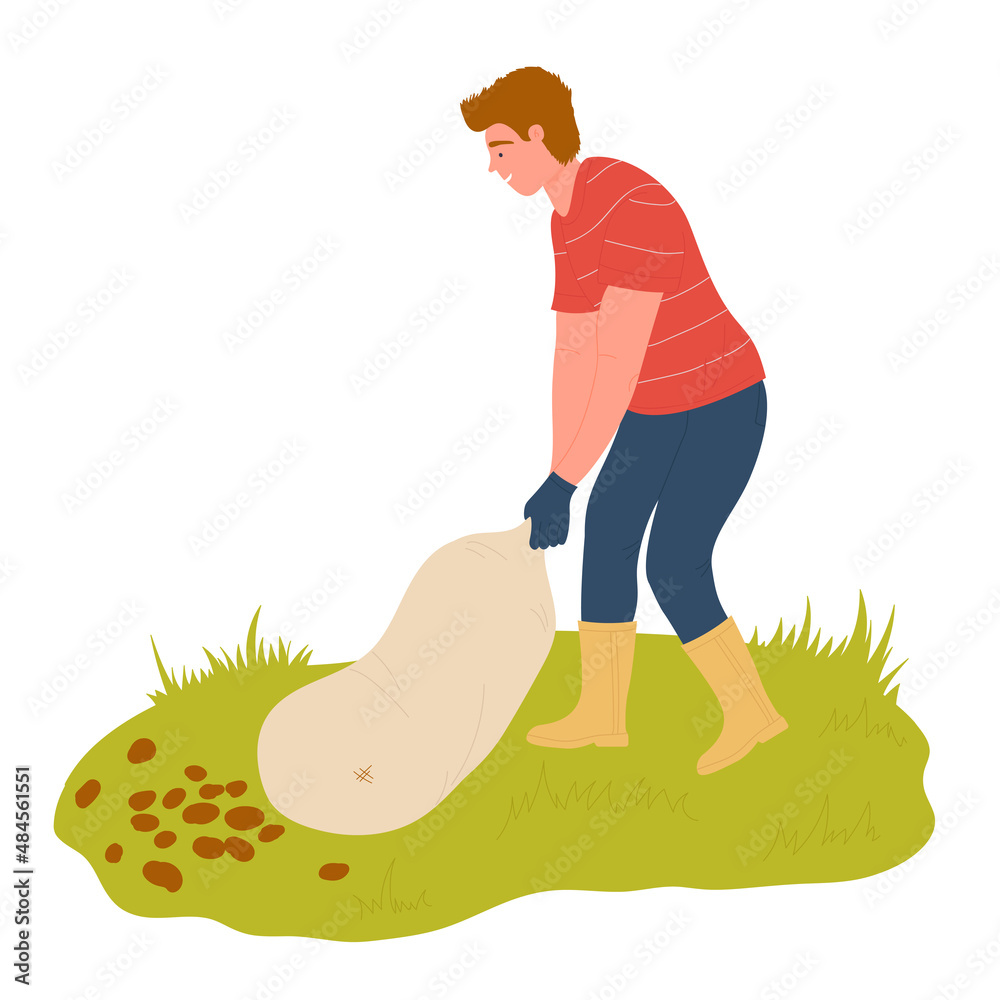 Equipped young boy picking up garden rubbish. Ecological farming daily ...