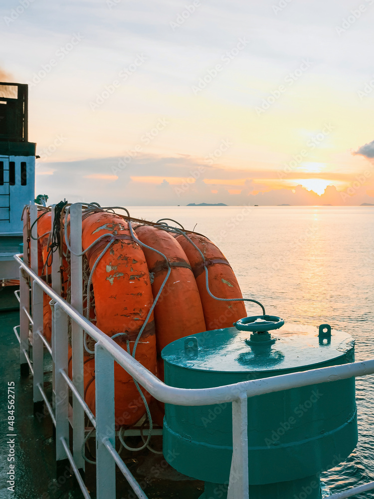 Orange inflatable lifeboats on ferry deck for emergencies and maritime ...