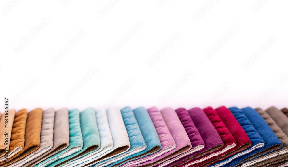 Fabric swatches in different colors are stacked for selection. A ...