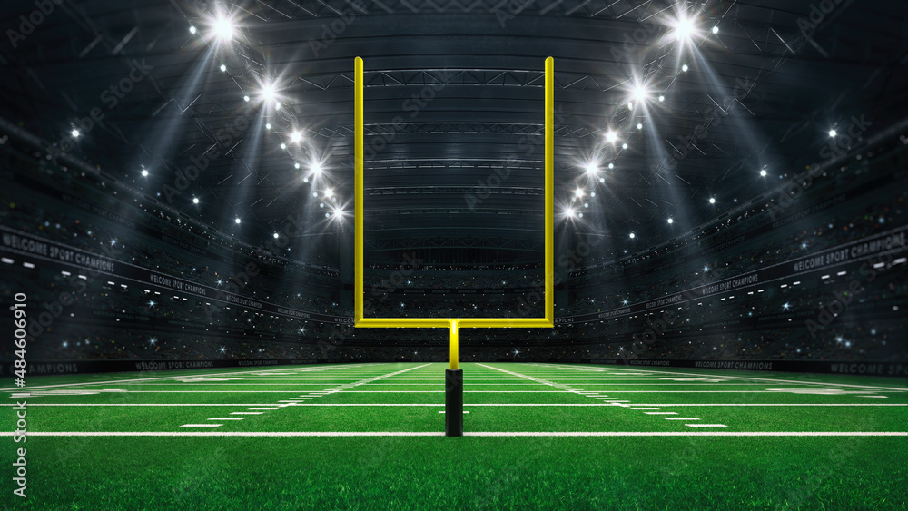 American football stadium with yellow goal posts, grass field and fans ...