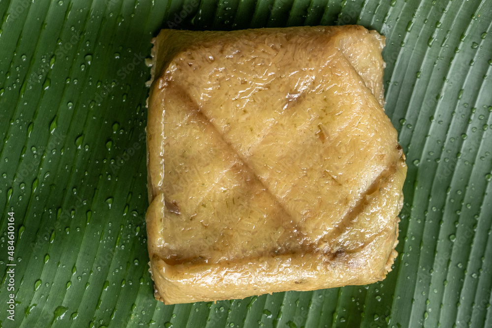 Chung cake, wrapped with dong leaves and bamboo chips, Vietnamese ...