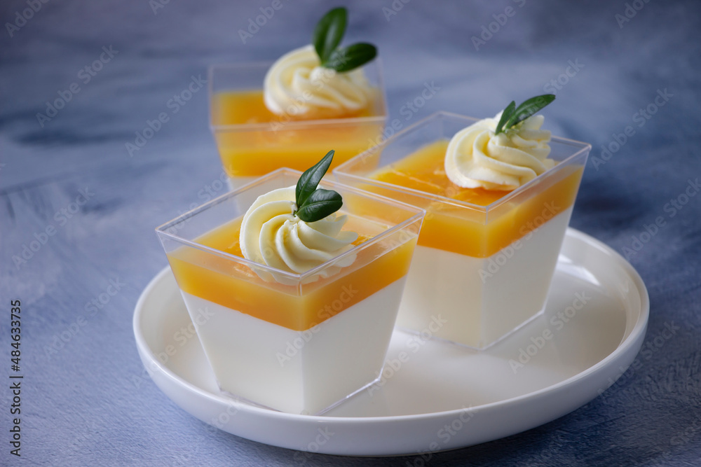 Orange panna cotta in a portion cups, citrus fruits dessert, low ...