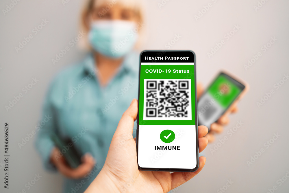 Covid-19 control. Coronavirus vaccinated people scan QR code visitor on ...
