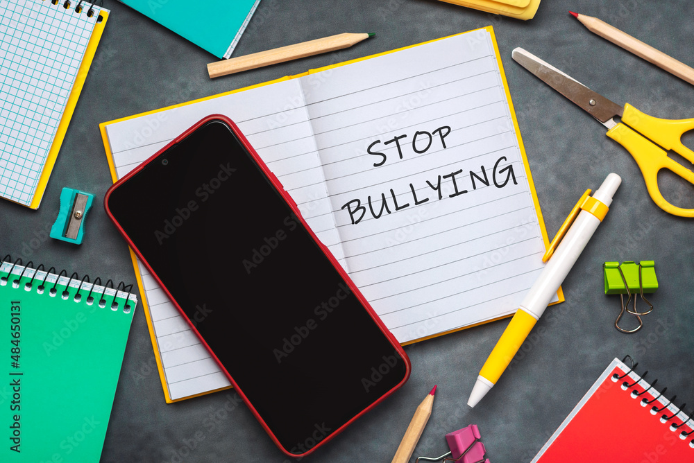 Stop bullying. Top view of notebook with the text Stop bullying, school ...