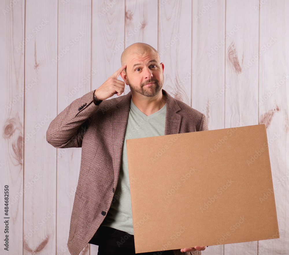 business man holding up a cardboard sign blank making gestures and ...