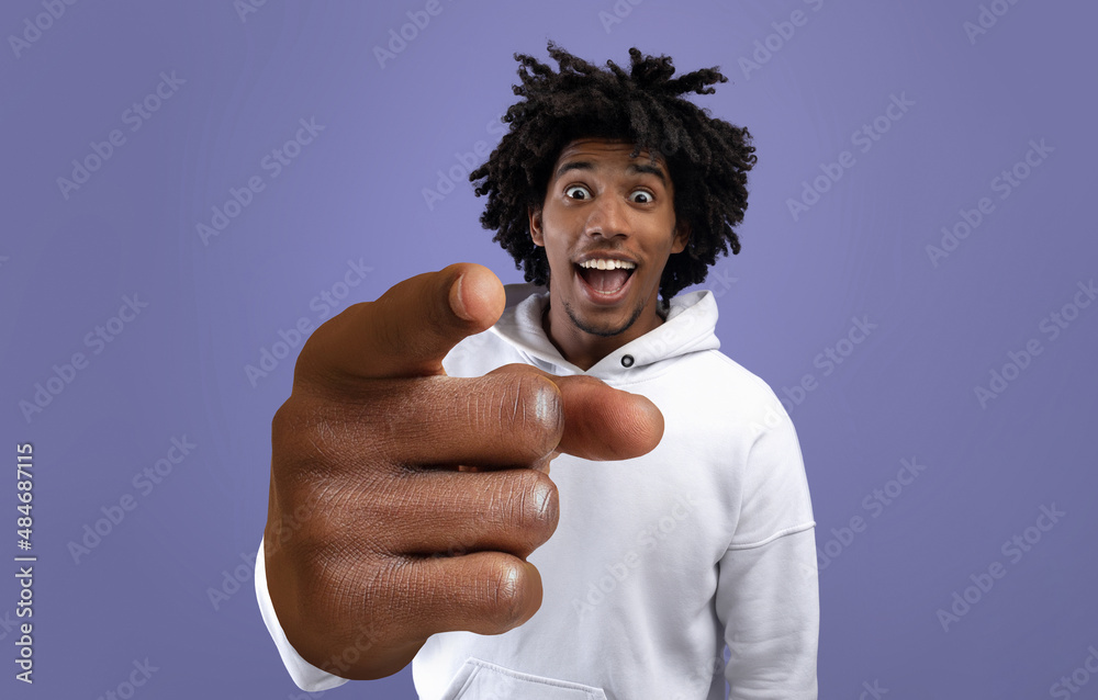 Funky black teen guy pointing index finger at camera, making big I ...