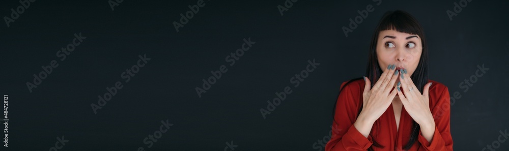 Close-up portrait of young emotional brunette woman with oops emotion ...