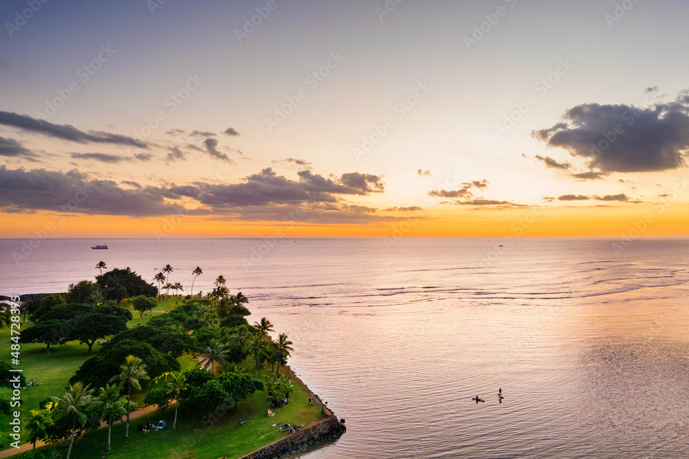 Aerial view of horizon at a golden hour sunset from Ala Moana Beach ...