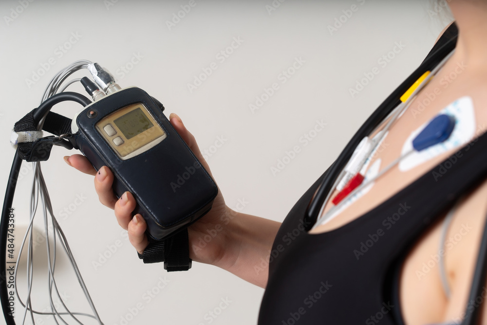 ECG sensors, electrocardiogram and blood pressure measurement. Woman ...