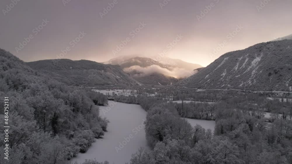 Aerial drone shots in the mountains covered in snow at sunset, Pyrenees ...