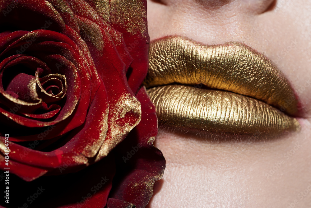 Gold Paint from the lips. Golden lips on beautiful model girls mouth ...