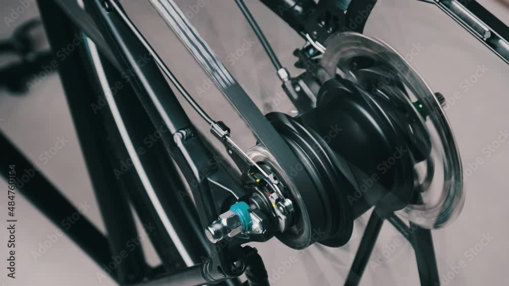 The planetary gear on a belt driven bike is rotating. Gear change ...